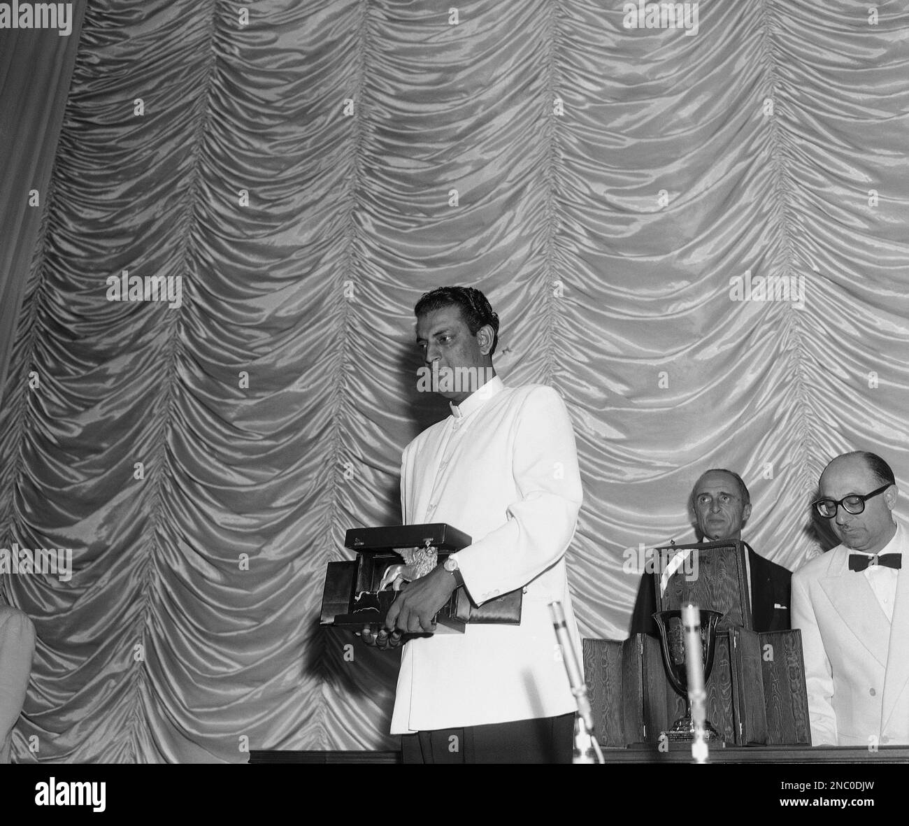 Indian director Satyajit Ray holds the Gold Lion, top award of the ...