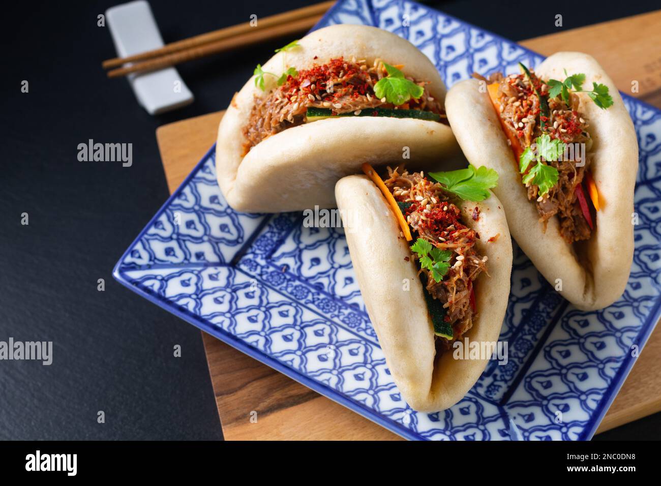 Food Concept Homemade Organic Pulled Beef Bao Buns Or Gua Bao In Sqare Plate On Black Background