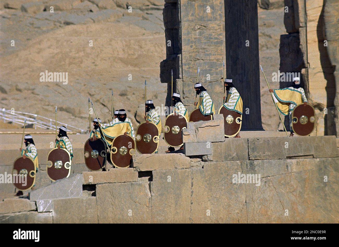 Iranian Army troops dressed in ancient Persian uniforms with swords and ...