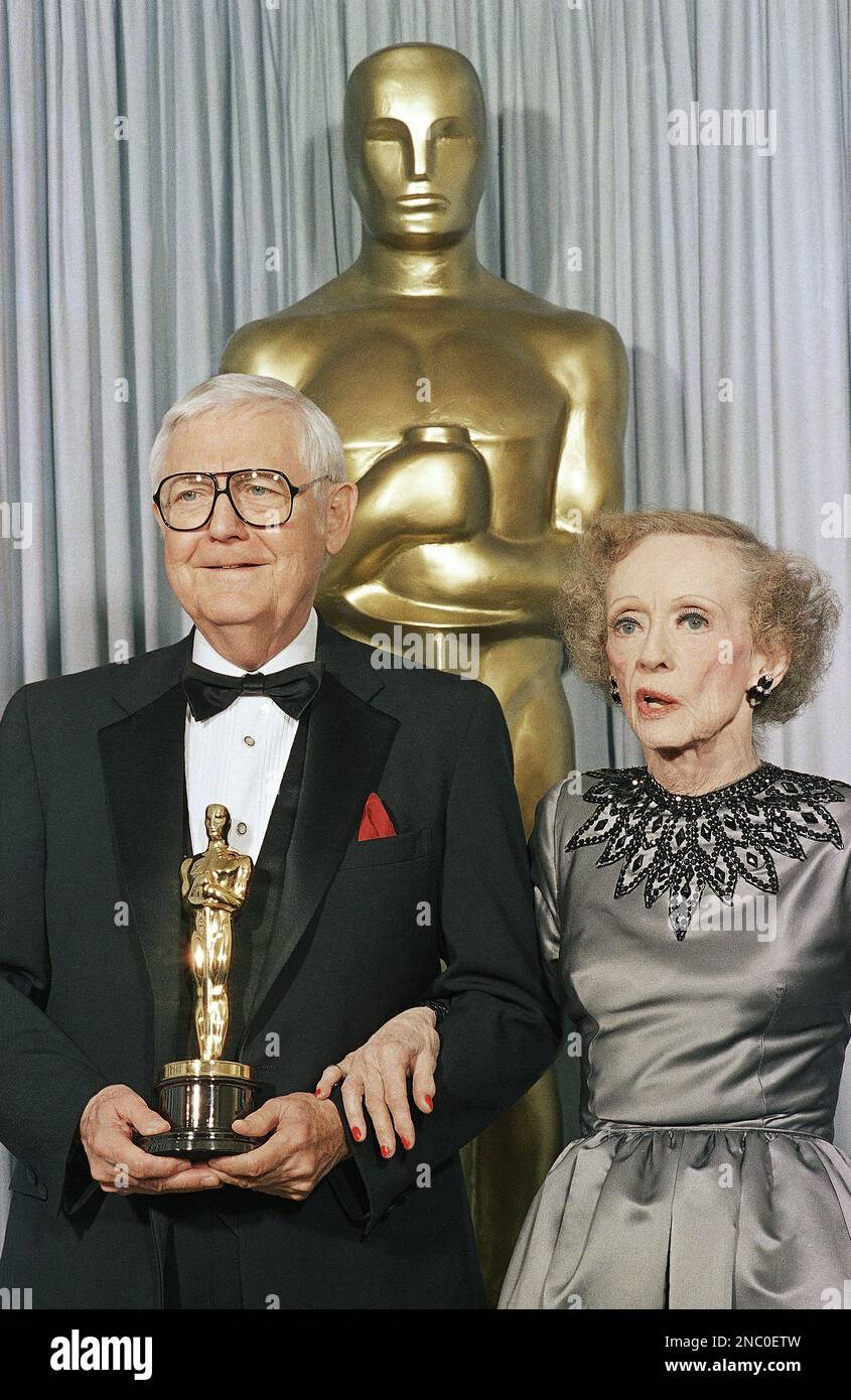 Director Robert Wise and actress Bette Davis pose together at the ...