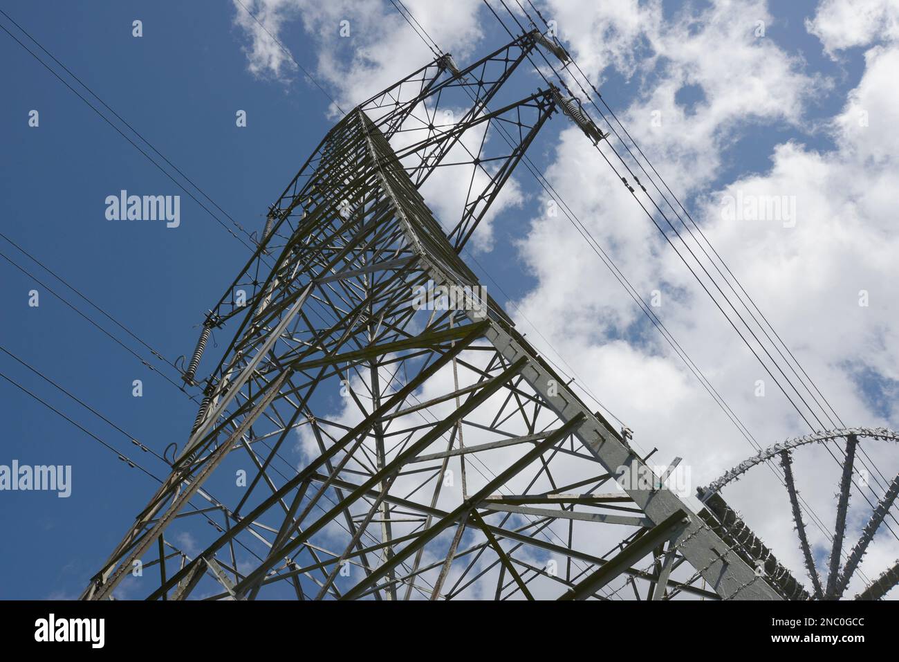 Electricity pylon from below Stock Photo - Alamy