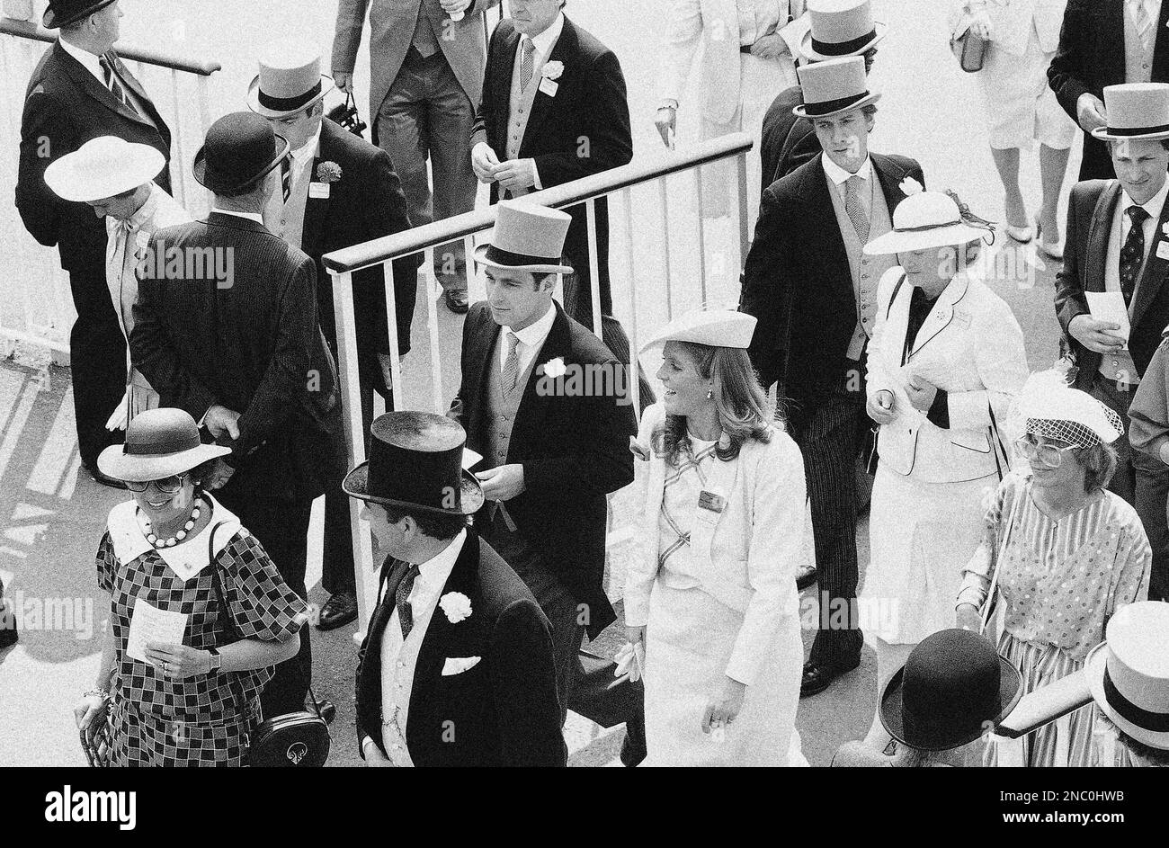 A top-hatted Britain’s Prince Andrew walks with Miss Sarah Ferguson at ...
