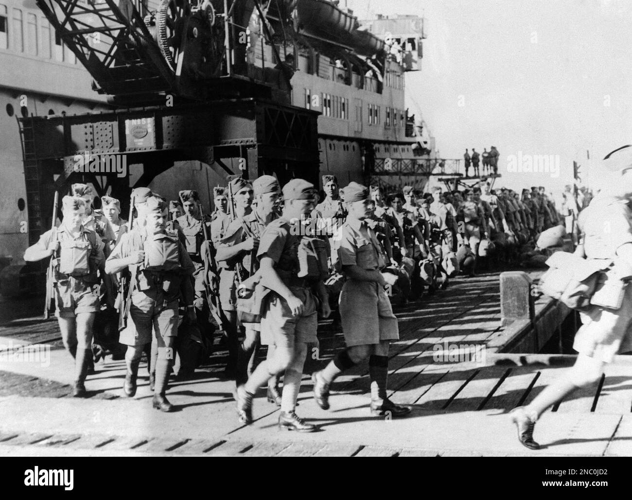 Canadian troops disembarked from their transport, marching into Hong ...