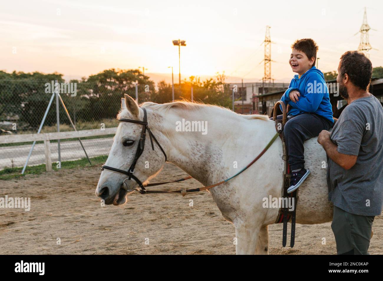 Child with disabilities having fun while enjoying a horseback ride ...