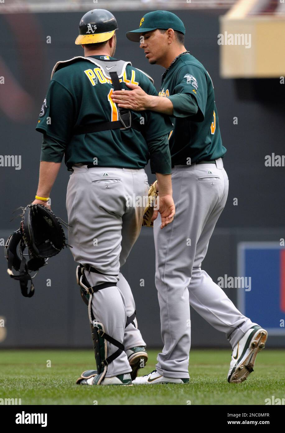 Oakland Athletics pitcher Brian Fuentes, right, pats catcher Landon ...