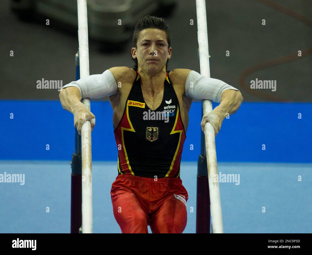 Marcel Nguyen of Germany competes to win the men's parallel bars final ...