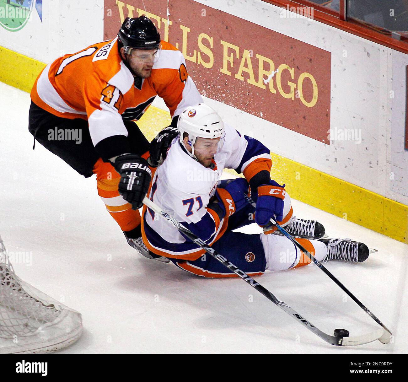 Philadelphia Flyers' Andrej Meszaros, left, rides New York Islanders ...