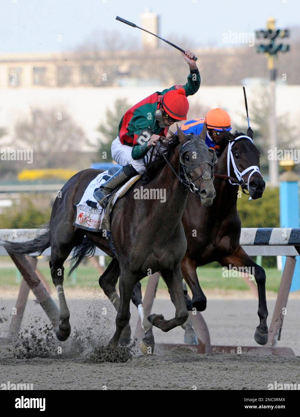 Jockey Eddie Castro rides Toby's Corner, left, to victory in the Wood ...