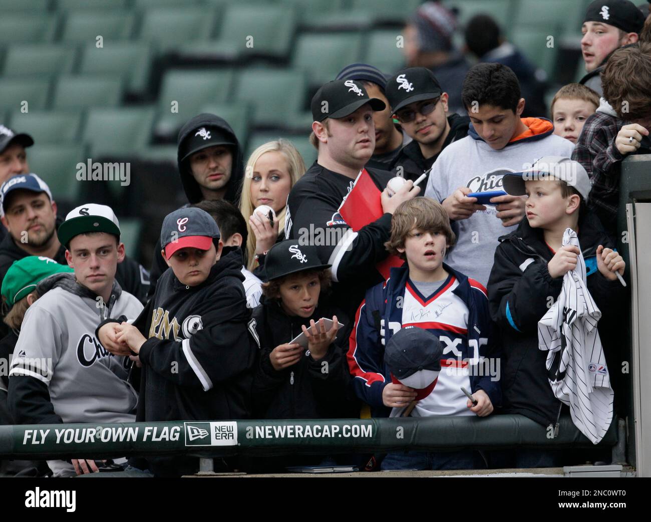 Chicago White Sox fans wait for an autograph from players before the ...