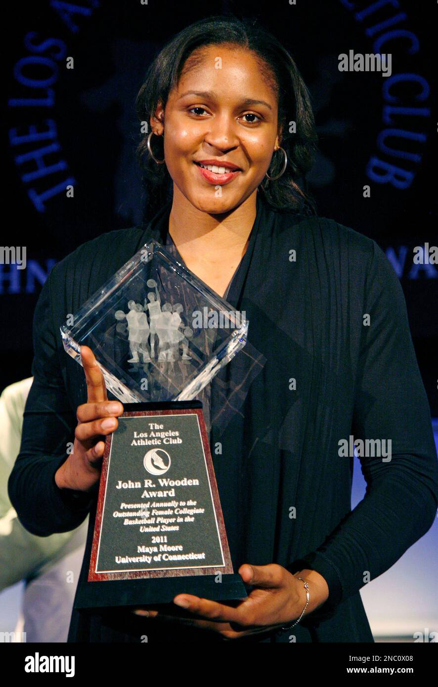 Maya Moore of the University of Connecticut poses with her trophy after ...