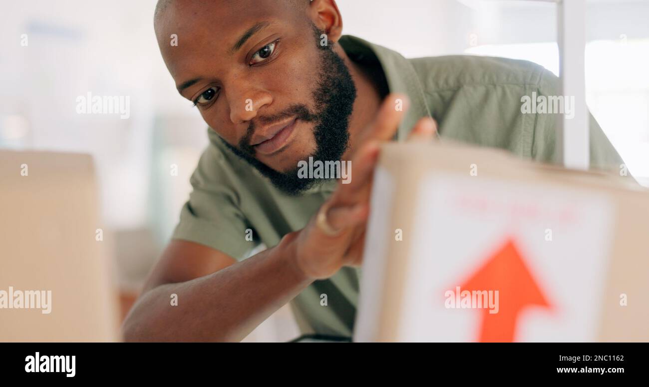 Logistics, inventory and small business man with boxes check stock on ...