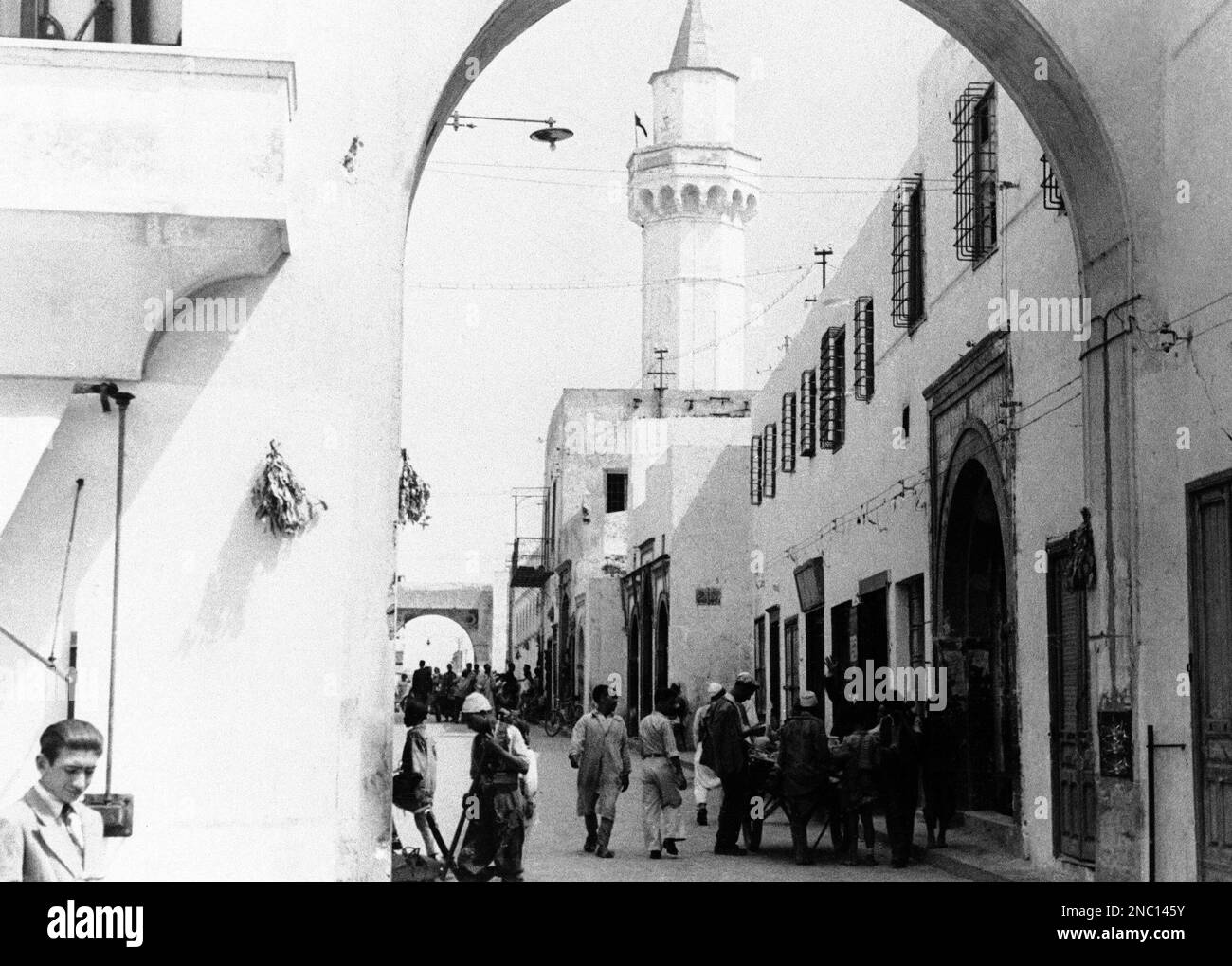 Street of shops in the Old City of Tripoli, Libya on June 7, 1949. At ...