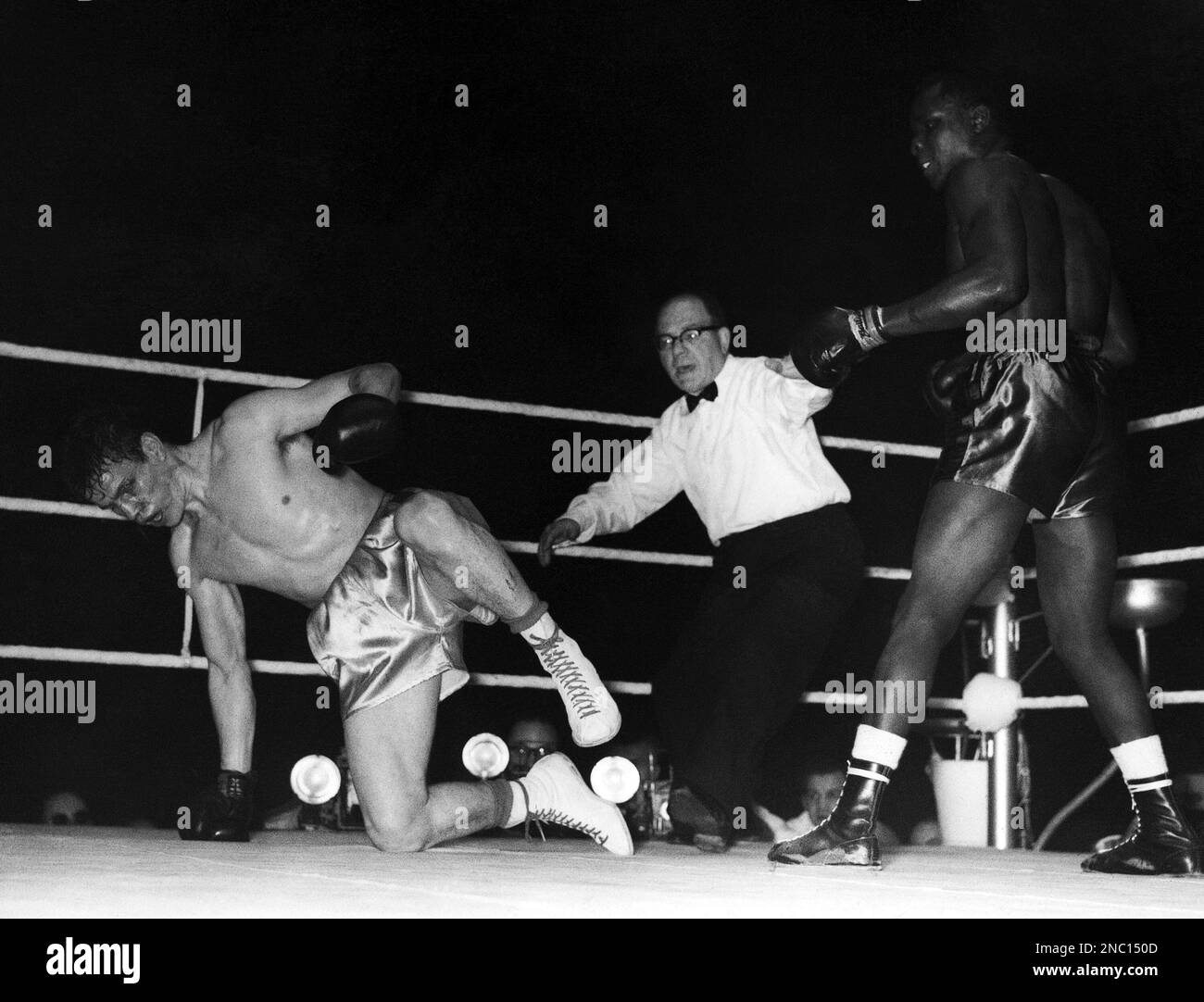 Terry Downes, British Middleweight Champion, is put down by the ...
