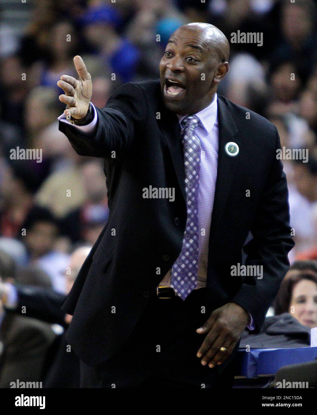 Golden State Warriors coach Keith Smart gestures from the sidelines ...