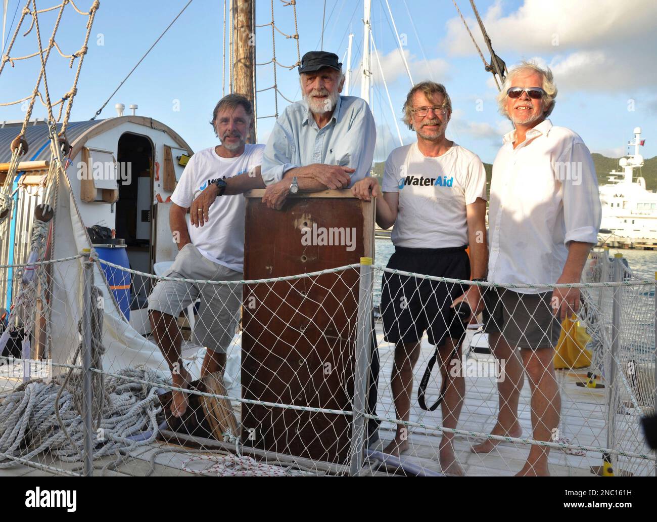 85-year-old British boat captain Anthony Smith, second from left ...