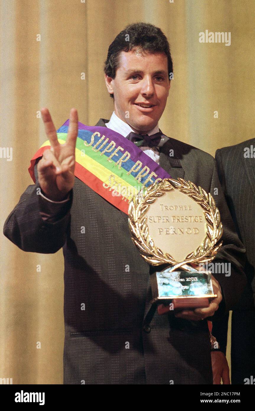 Irish cyclist Stephen Roche makes a peace sign as he poses with his ...