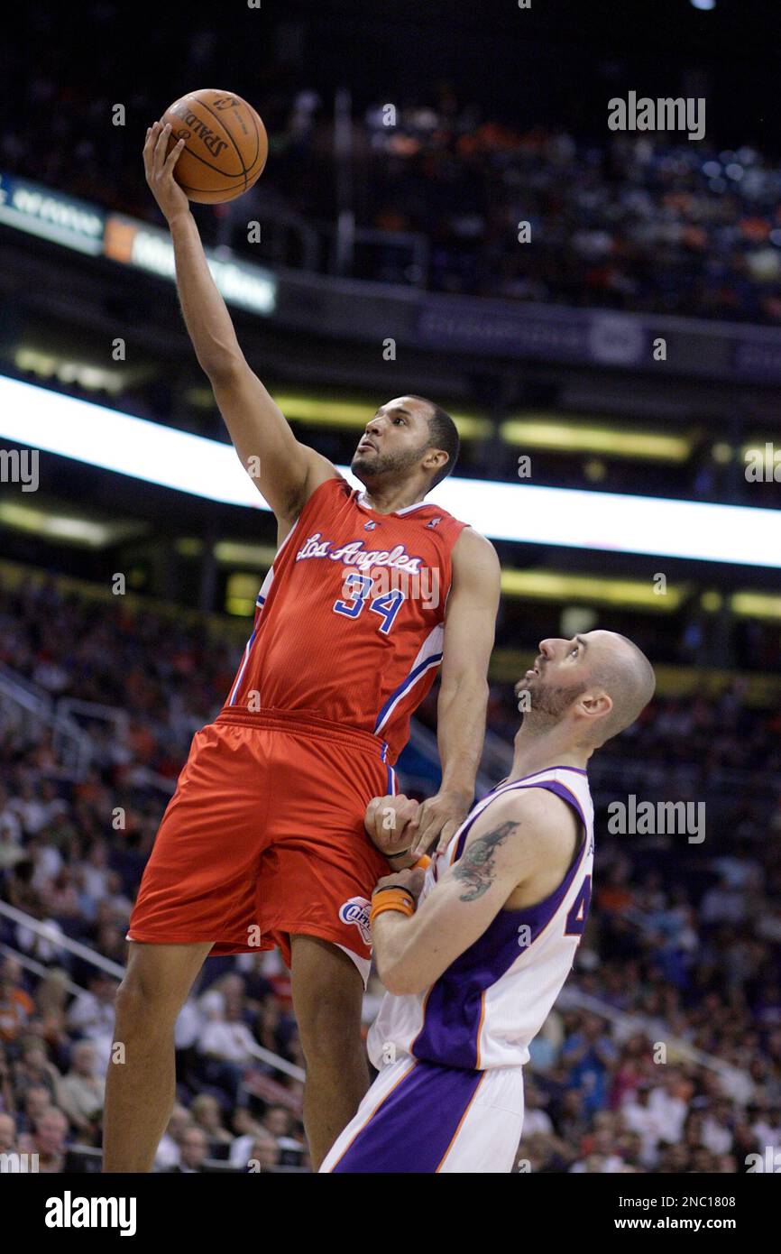Los Angeles Clippers' Brian Cook, left, against Phoenix Suns' Marcin ...