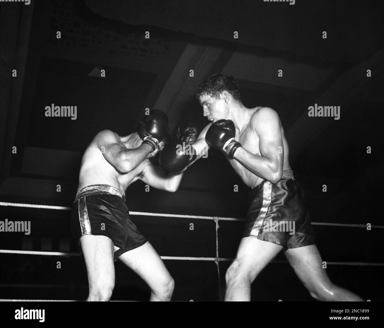 British middleweight champion Terry Downes, right, wades into Frenchman ...