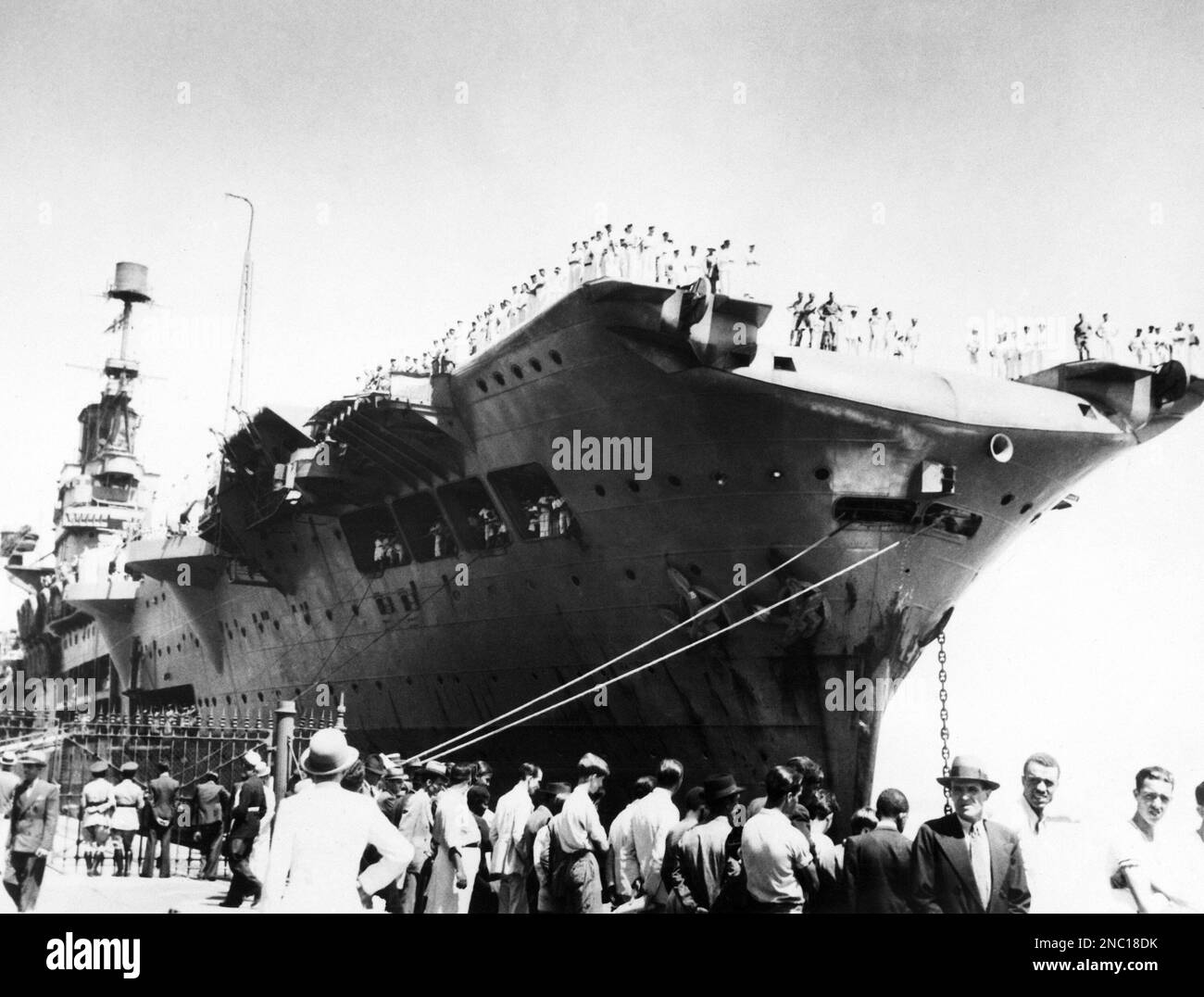 Crew members of the British aircraft carrier line the while the ark ...