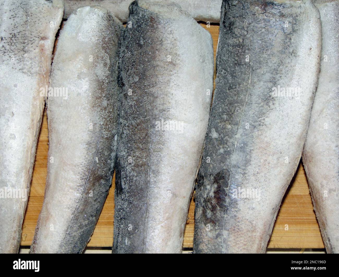 Pieces of hake fish taken out of the freezer Stock Photo - Alamy