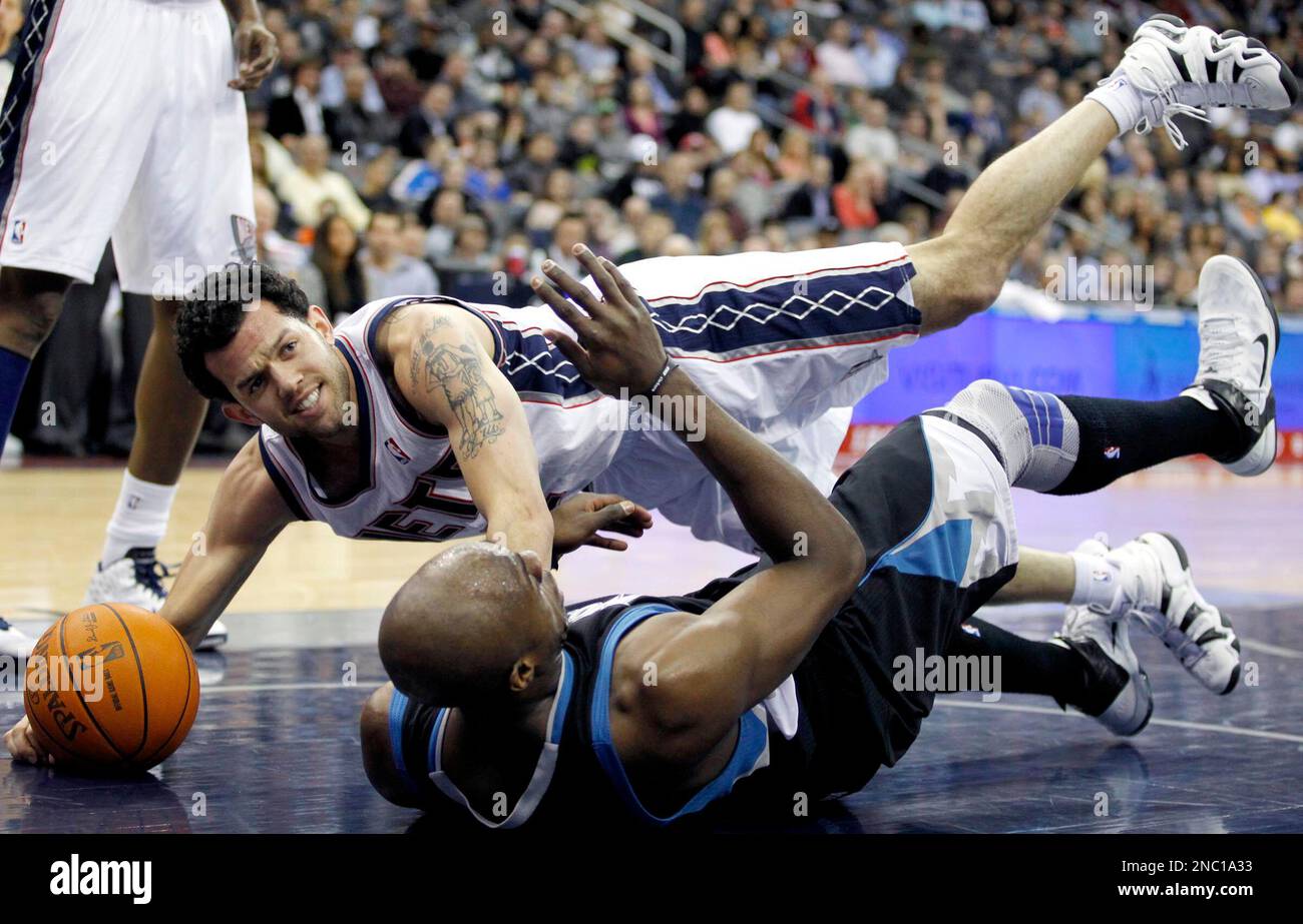 New Jersey Nets' Jordan Farmar, top, collides with Minnesota ...