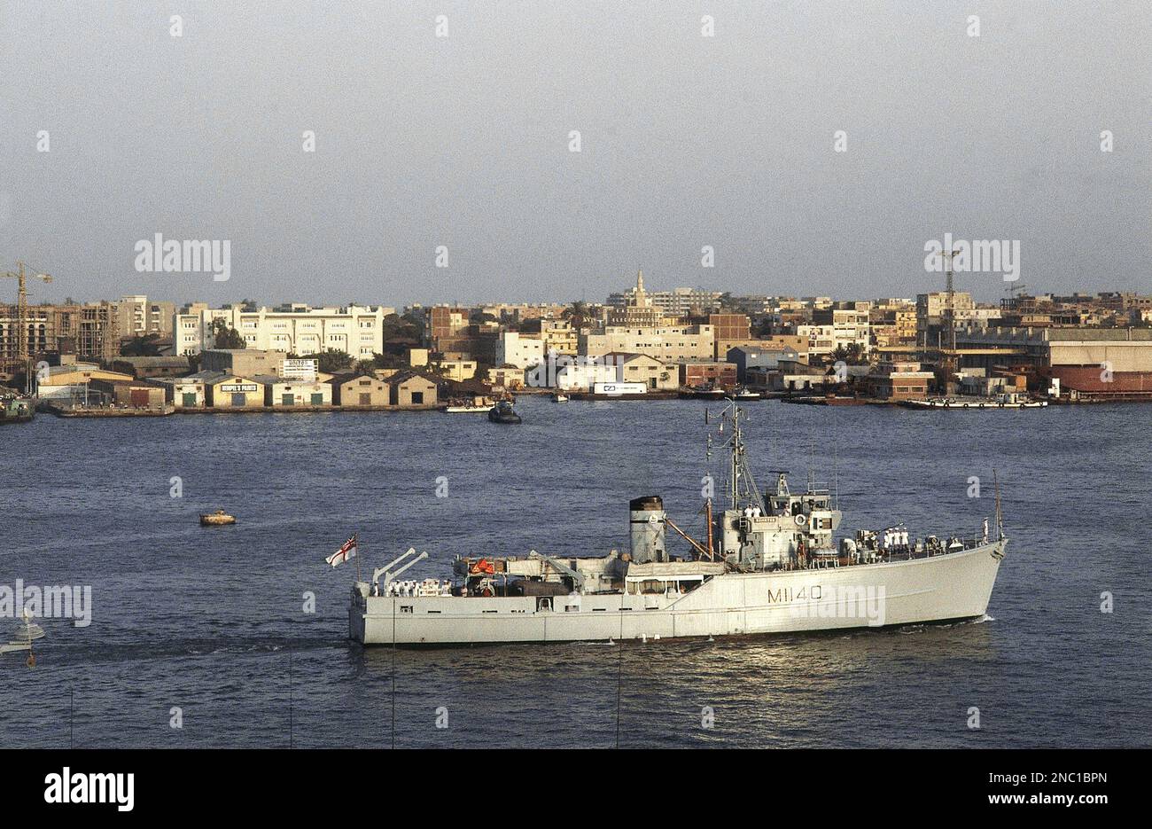 British mine sweepers move up the Suez Canal with Port Said, Egypt, in ...