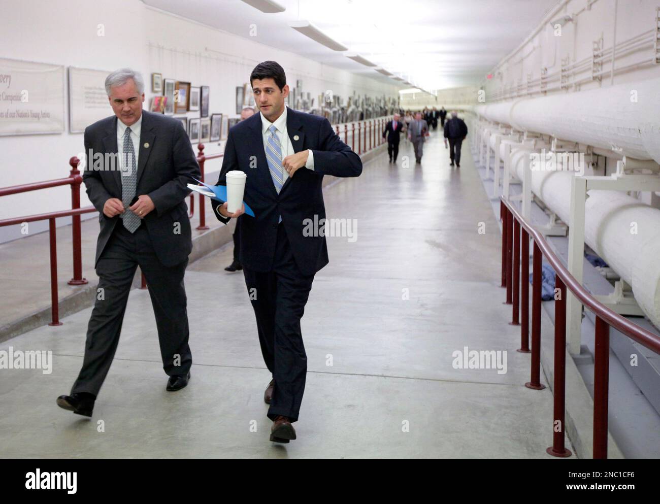 House Budget Committee Chairman Rep. Paul Ryan, R-Wis., right, walks ...