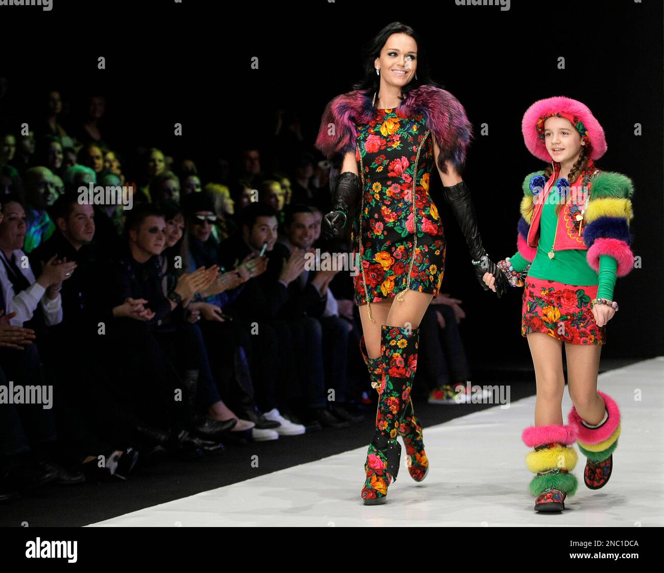 Russian singer Slava, left, and her daughter Sasha show a creation by ...