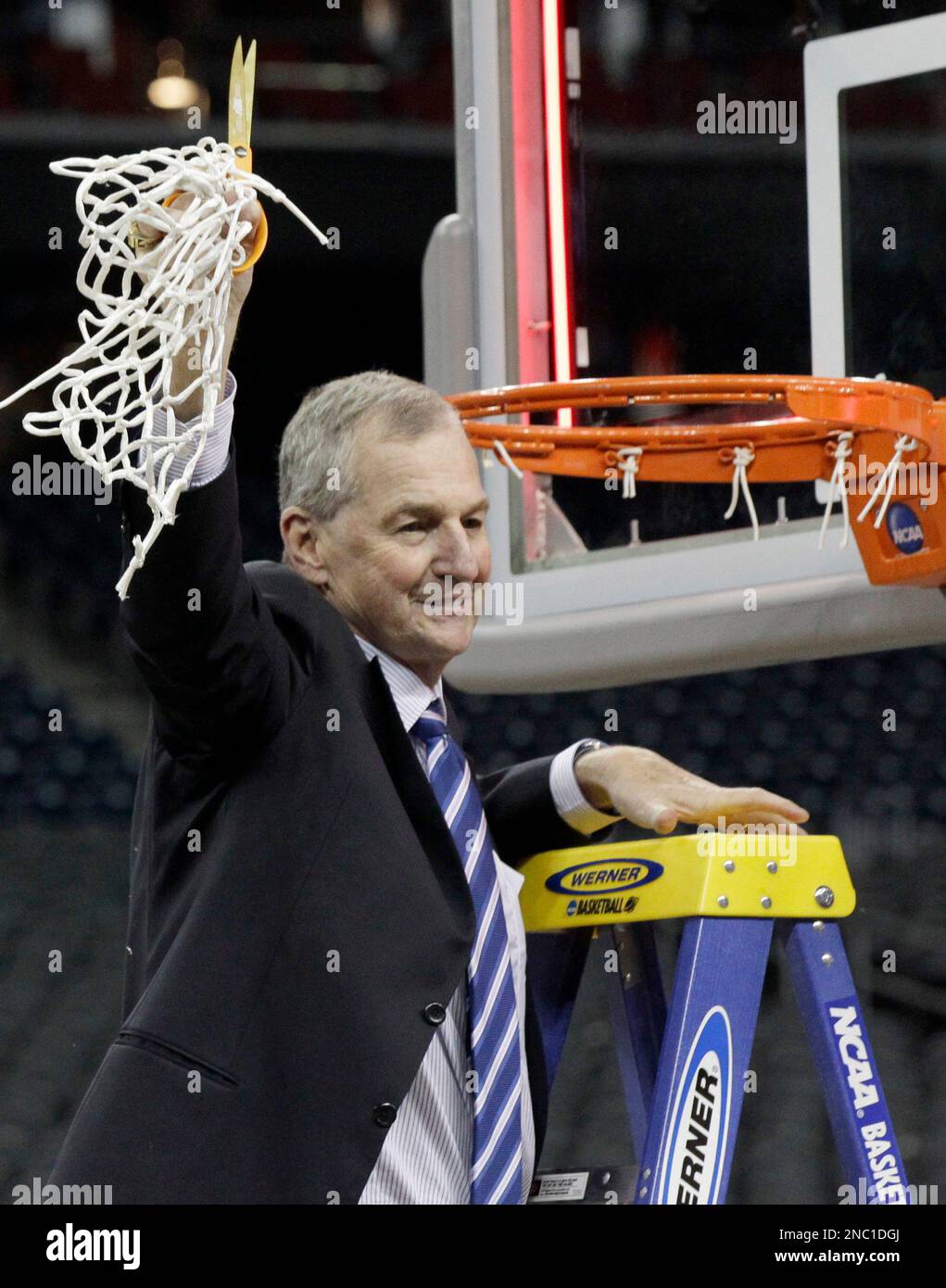 Connecticut head coach Jim Calhoun holds the net after his team won the ...