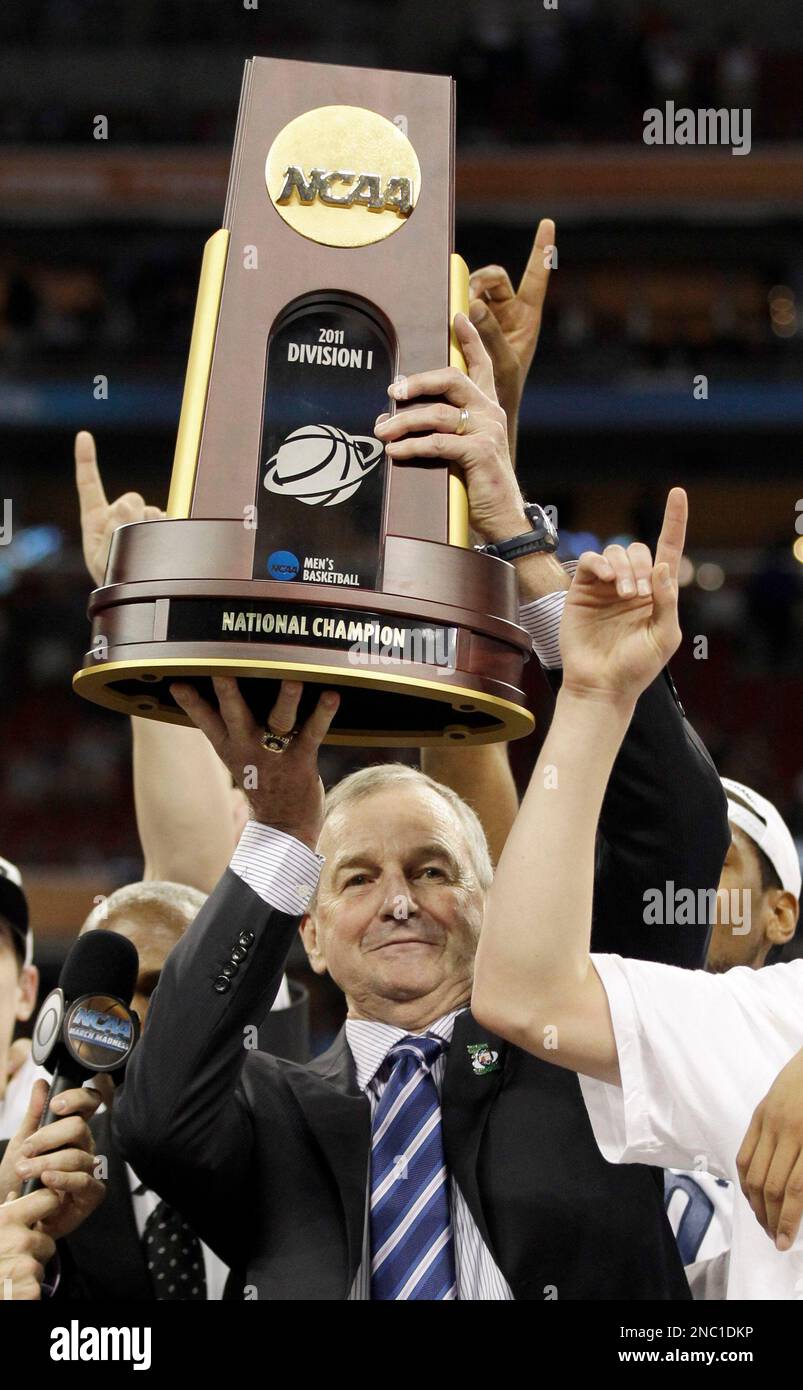 Connecticut head coach Jim Calhoun holds the championship trophy after ...