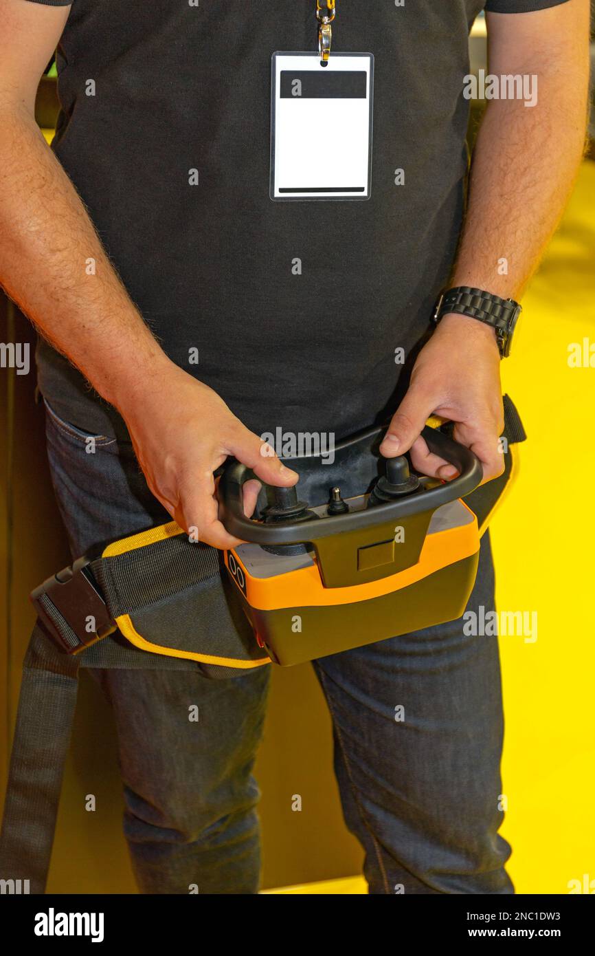 Worker Holding Remote Control With Joysticks for Construction Machinery ...