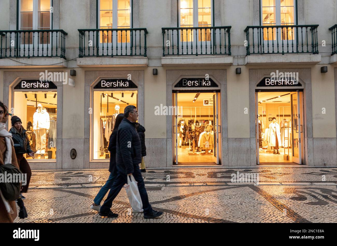 Bershka store in Lisbon illuminated Stock Photo - Alamy
