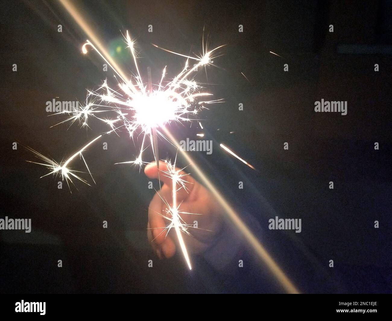 Hand-lit fireworks for New Year's Eve Stock Photo - Alamy
