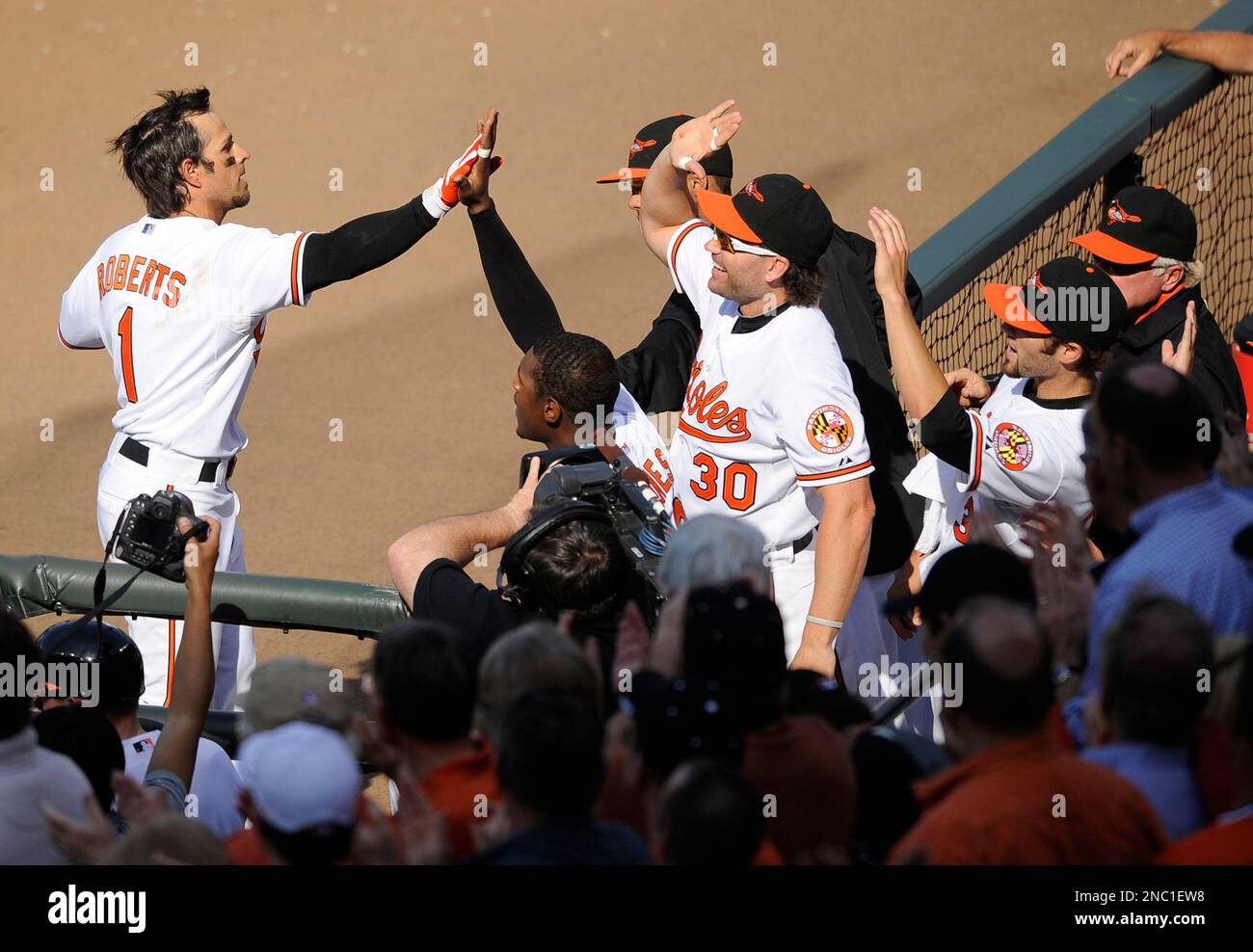 Baltimore Orioles' Brian Roberts (1) celebrates his three-run home run ...