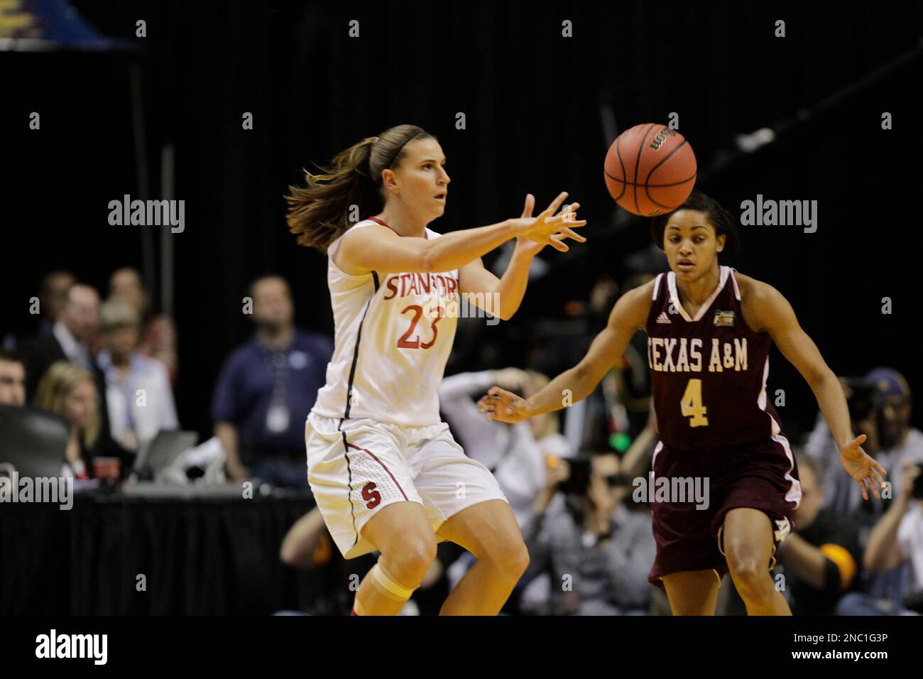 Stanford's Jeanette Pohlen (23) passes tha ball past Texas A&M's Sydney ...