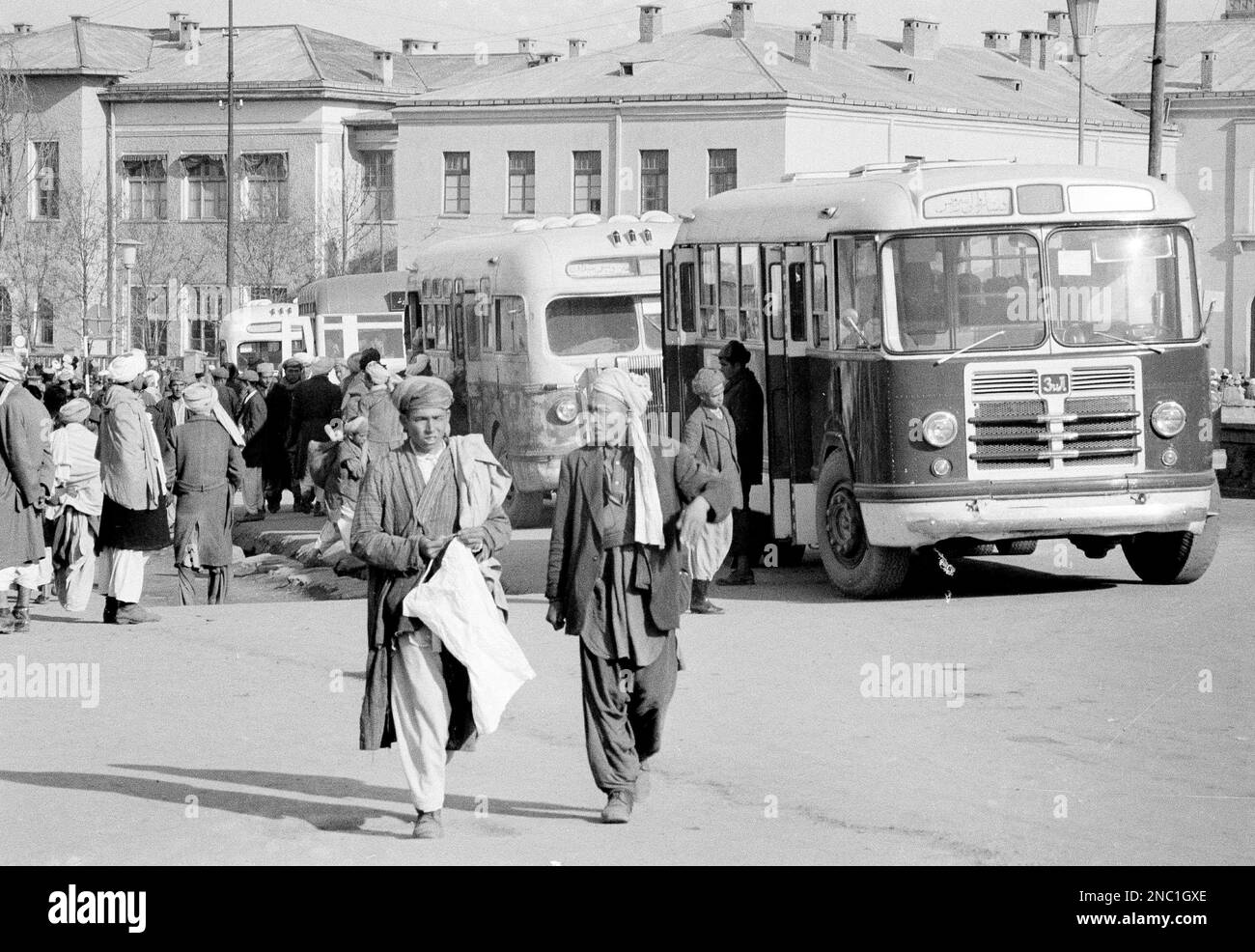 Modern buses, chiefly Russian Zil, on Kabul river embankment drive on ...