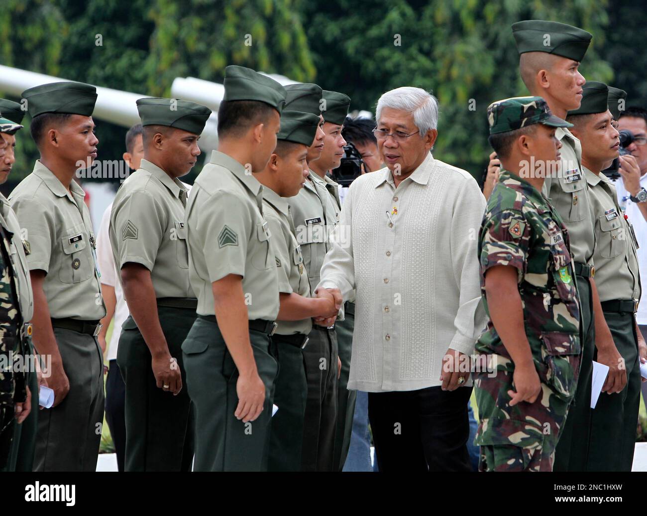 Philippine Defense Secretary Voltaire Gazmin congratulates enlisted ...