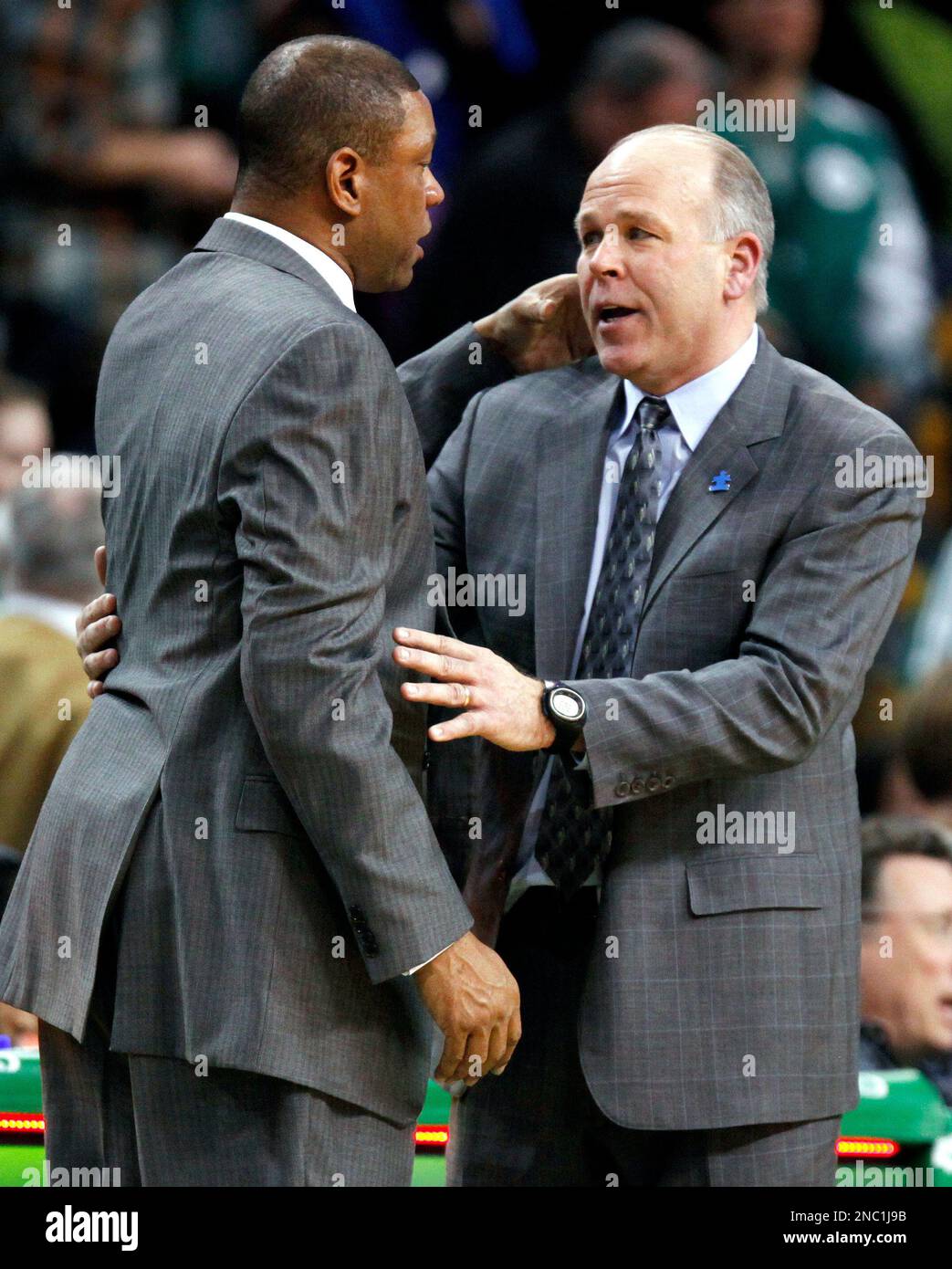 Boston Celtics coach Doc Rivers, left, talks with Detroit Pistons coach ...