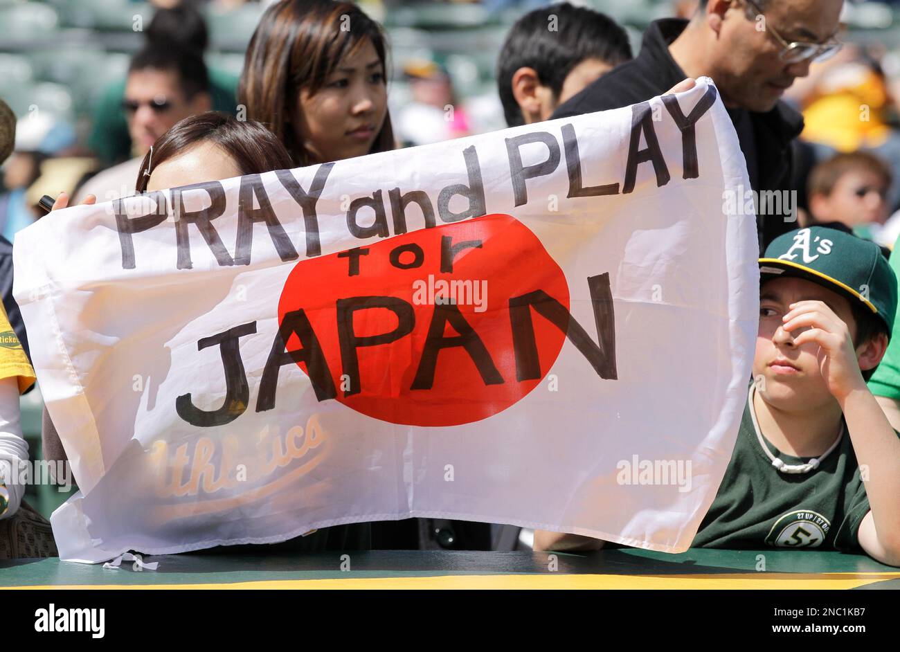 Oakland Athletics fans hold a Japanese flag on Japanese Heritage Day ...