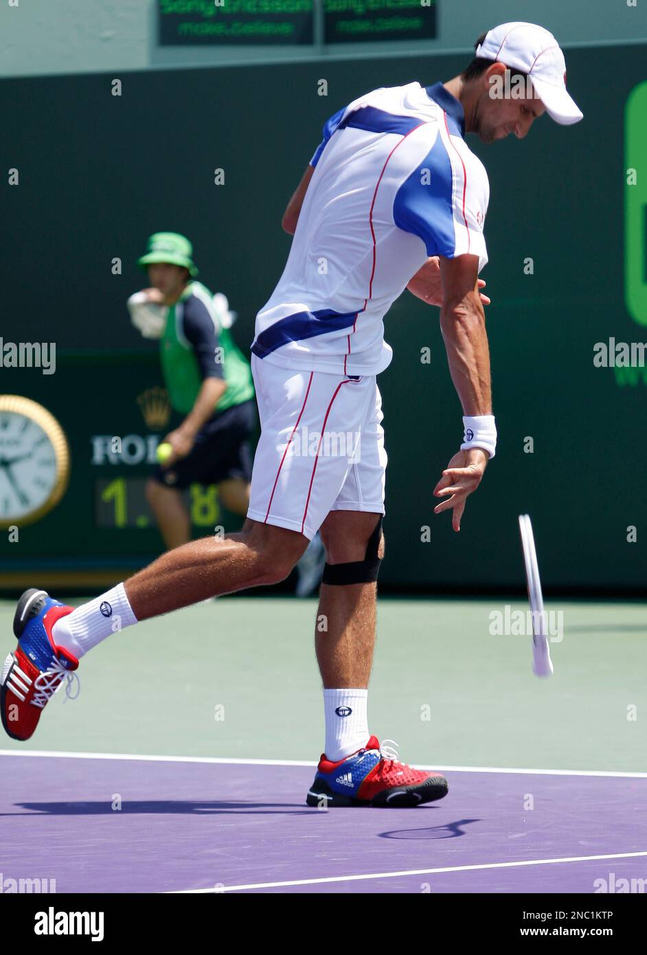 Novak Djokovic, of Serbia, throws his racket during his match against ...