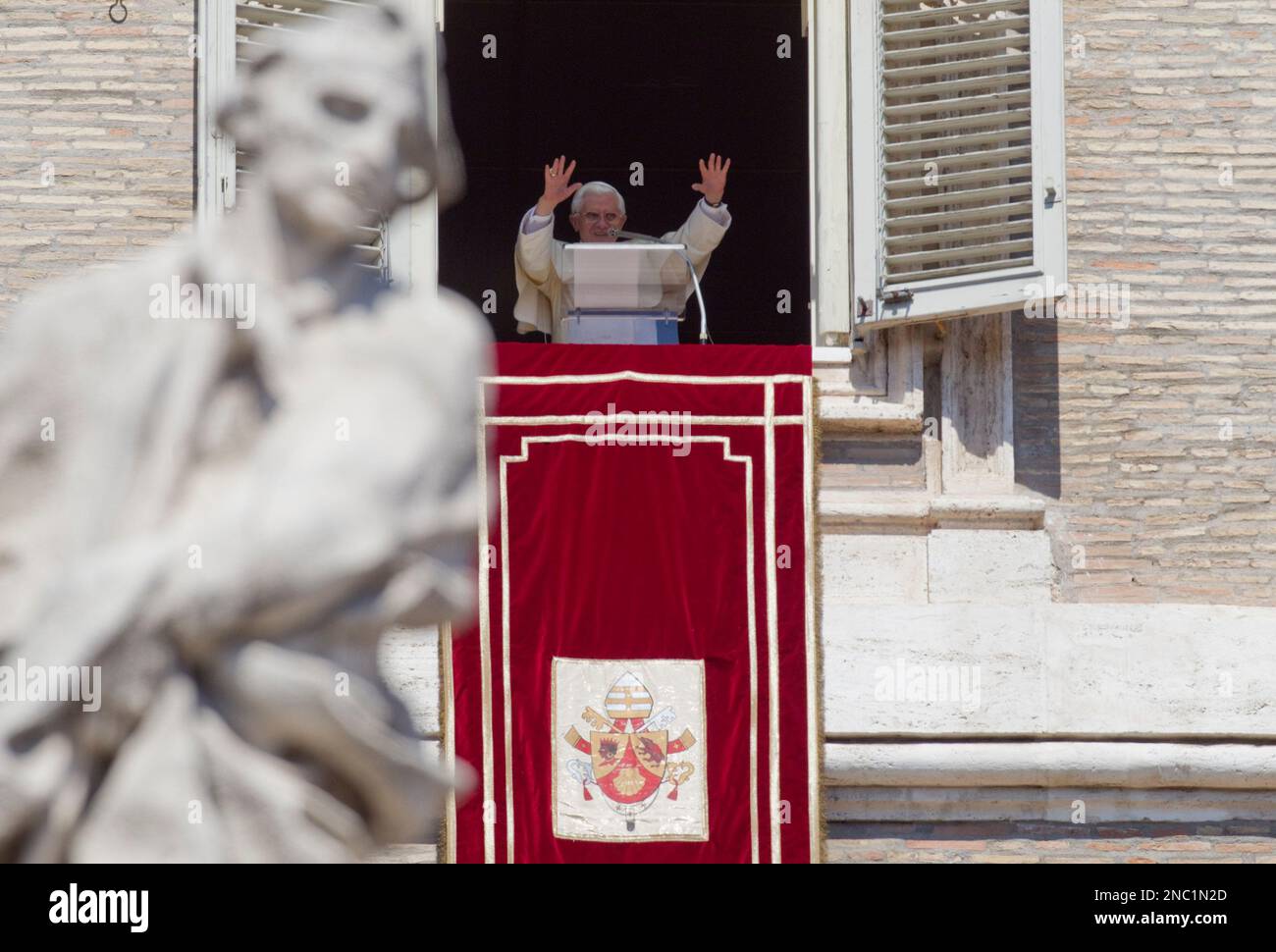 Pope Benedict XVI delivers his blessing during the noon Angelus prayer ...