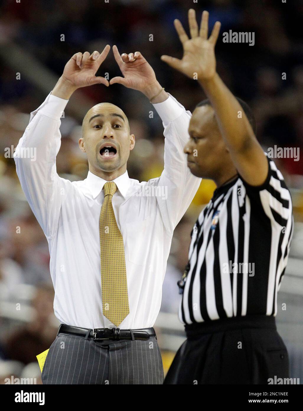 Virginia head coach Shaka Smart signals during the first half of a men ...