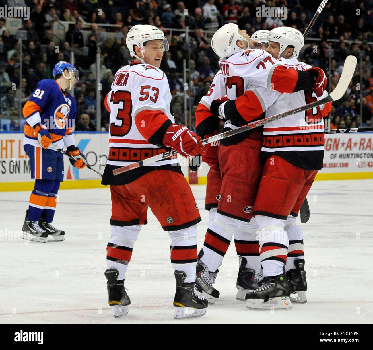 Carolina Hurricanes' Joe Corvo (77) celebrates his goal with teammates ...