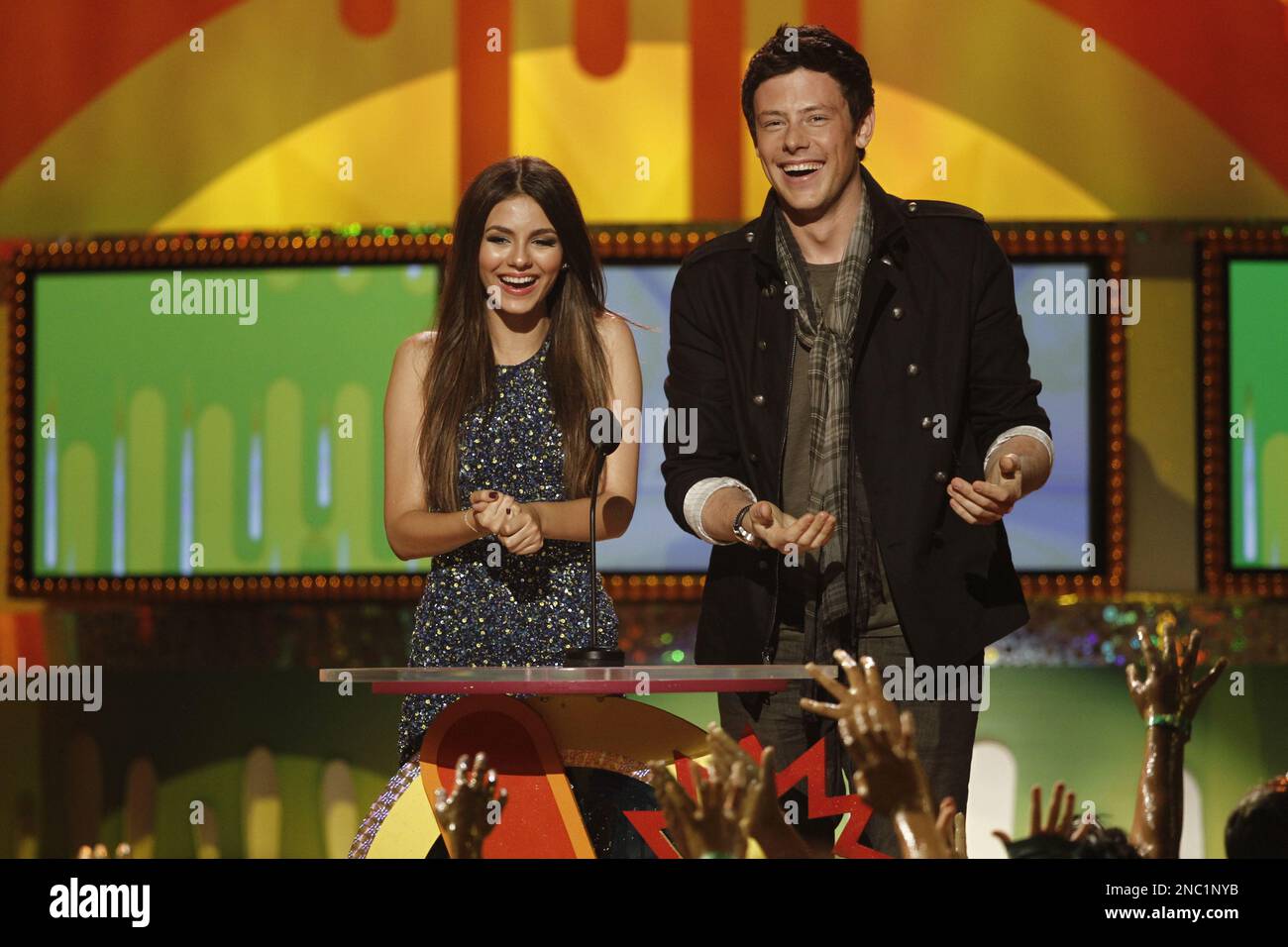 Victoria Justice, left, and Cory Monteith present the award for ...