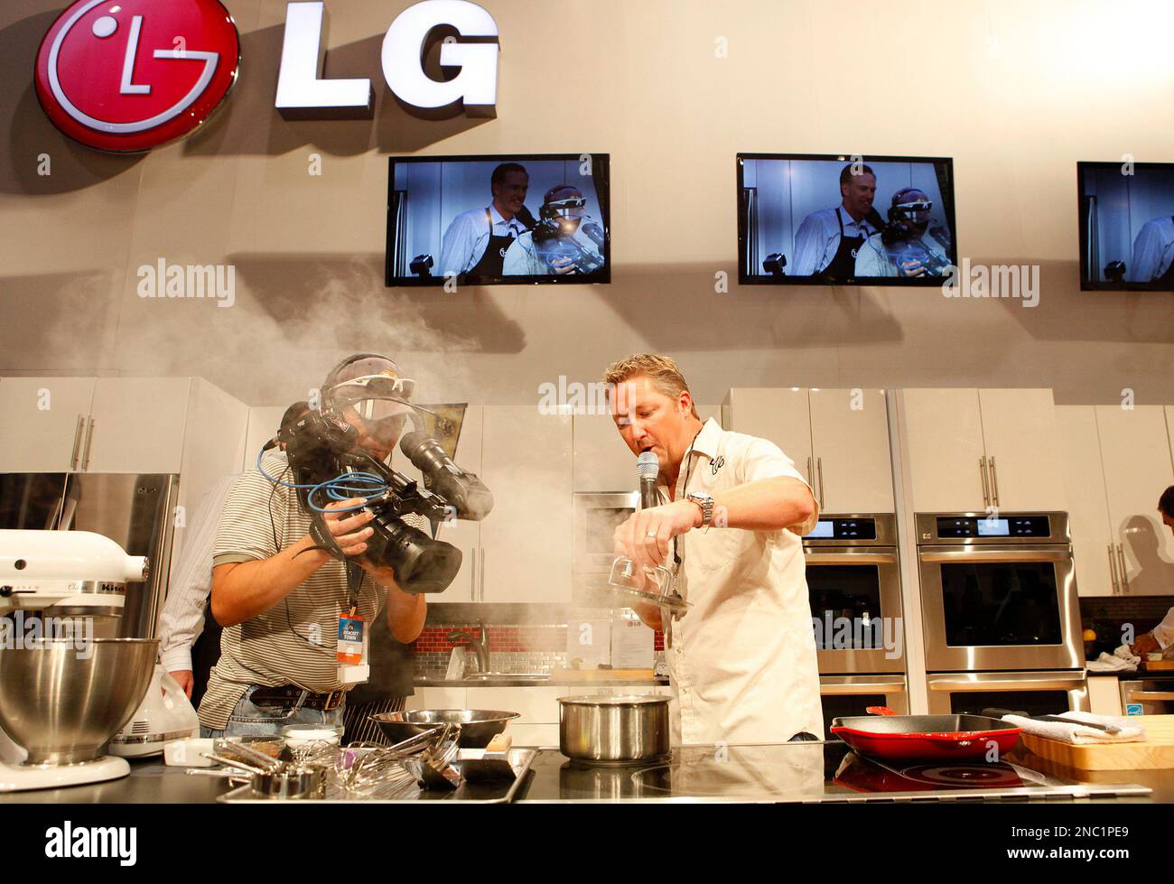 Tim Love, right, celebrity chef and emcee, gives the audience cooking ...