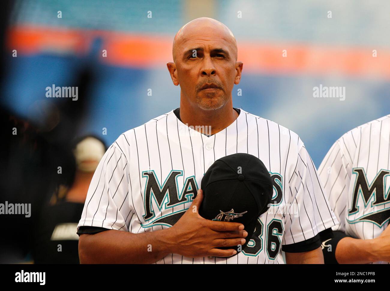 Florida Marlins manager Edwin Rodriguez stands for the national anthem ...