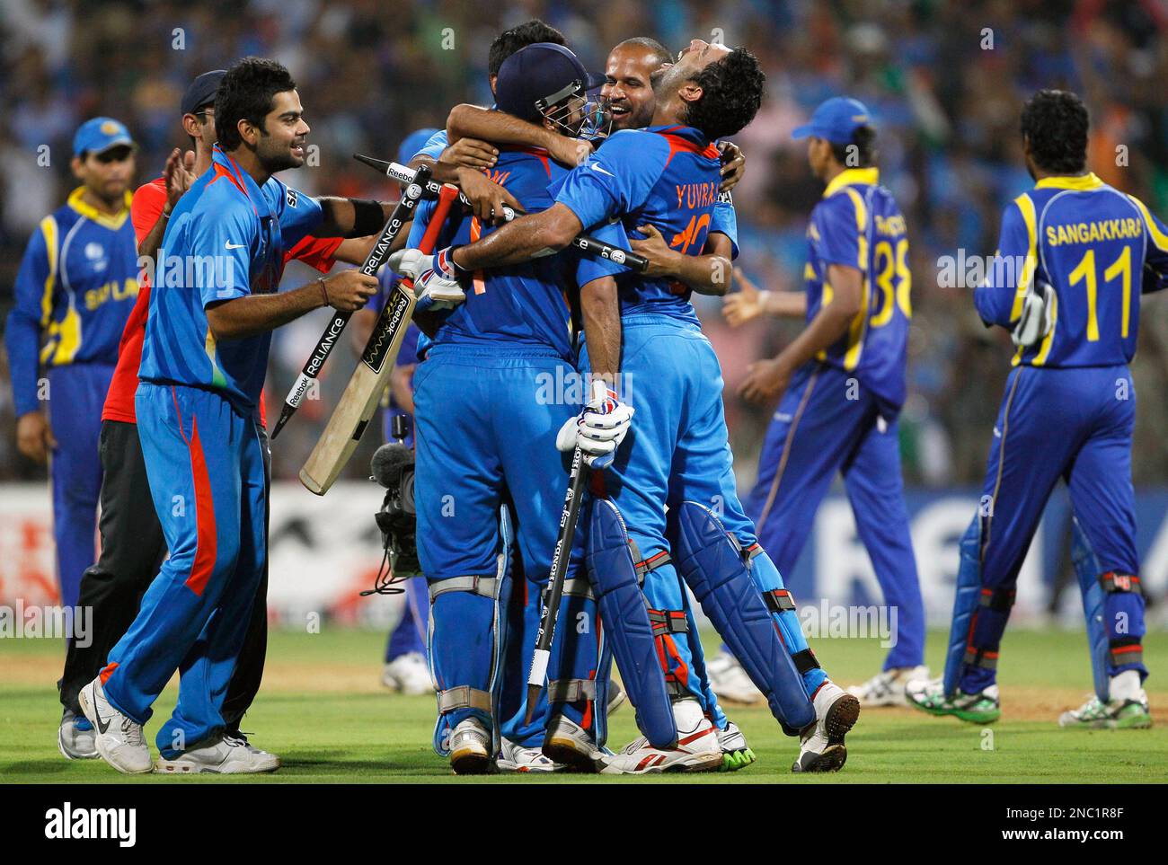 India's players celebrate their win in the Cricket World Cup final ...