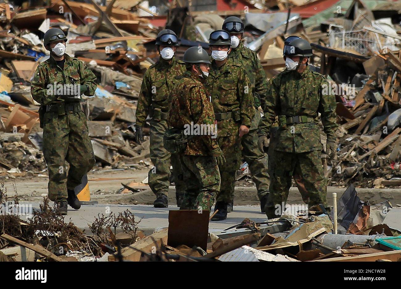 Members of the Japan Ground Self-Defense Force gather to search the ...
