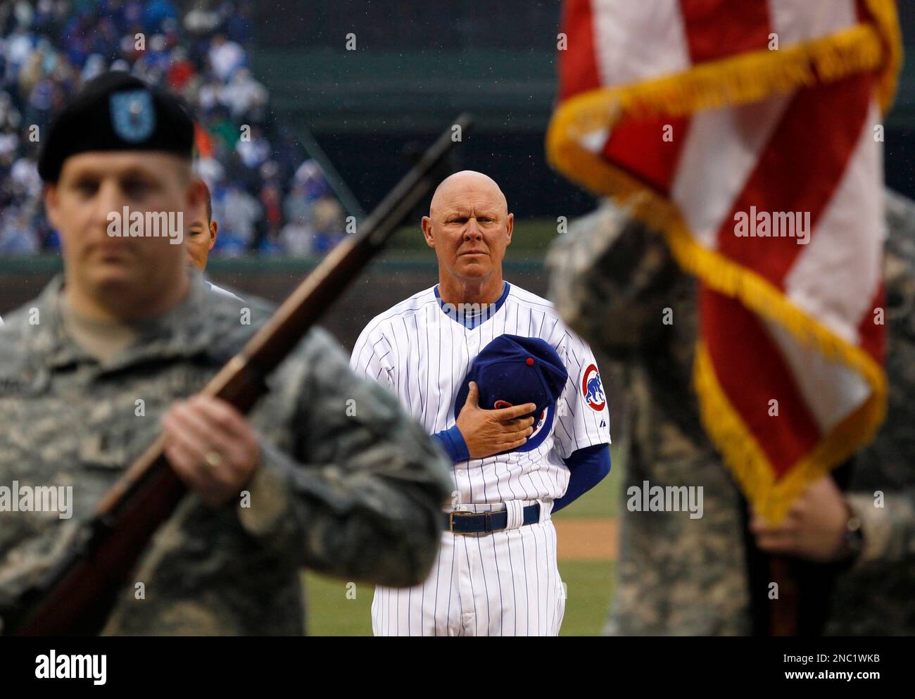 Chicago Cubs manager Mike Quade places his cap over his heart, before a ...