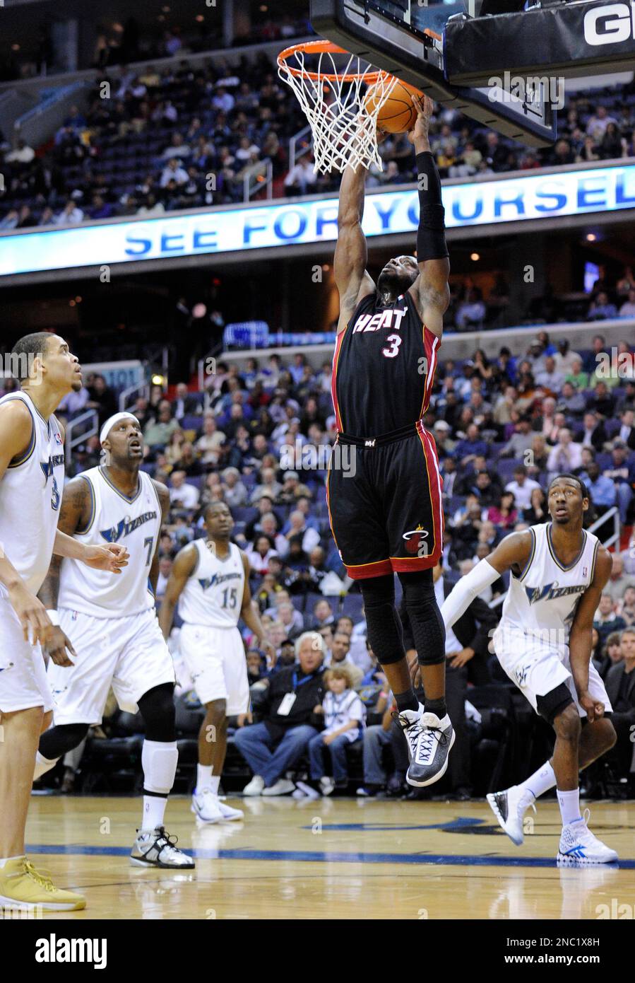 Miami Heat shooting guard Dwyane Wade (3) dunks against from bottom ...